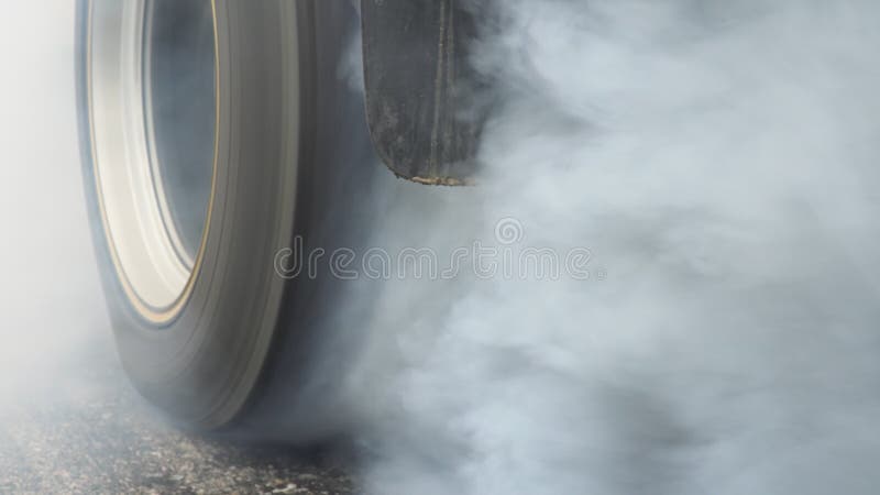 Drag Racing Car Burning Tire at Startline in Preparation for the Race ...