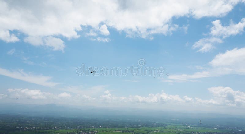 Dragonfly in the Blue Sky stock photo. Image of white - 76342424