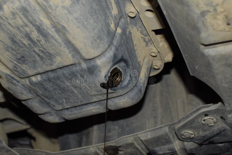 Drain the Old Oil from the Engine through the Drain Plug Stock Photo ...