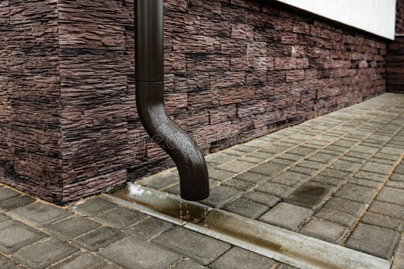 Drain Pipe on the Brown Brick Wall. Downspout. Stock Image - Image of ...