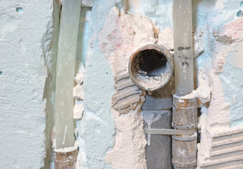 Drain Pipe and Water Pipes in a Plaster Wall Stock Photo - Image of ...