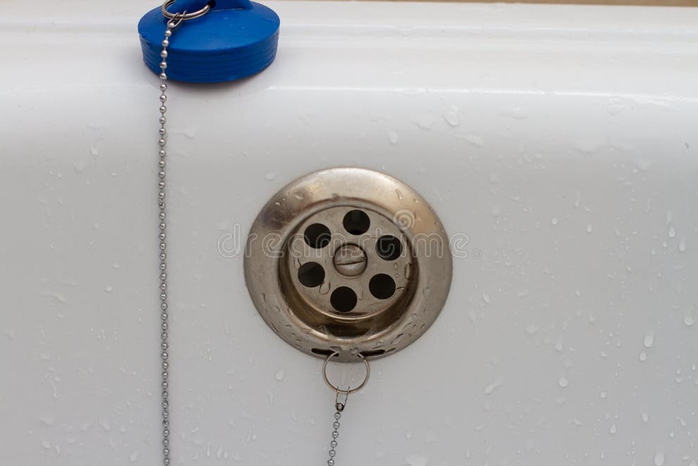 Drain plug on white bathe stock photo. Image of hole - 137272882