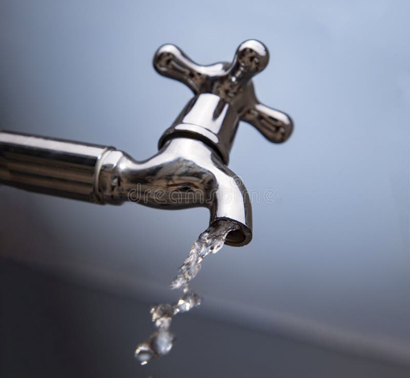 Drain Water From The Metal Tap Water Flowing From Modern Faucet Stock