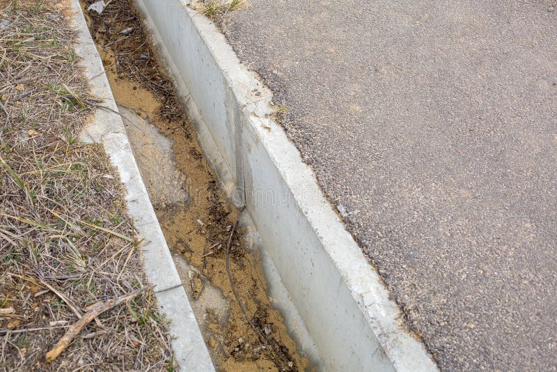 Drainage Gutter Made of Concrete on the Side. Stock Image - Image of ...
