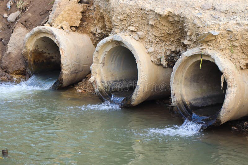 Drainage Pipe. Close Up Water Flows through a Drainage Pipe To the Next ...