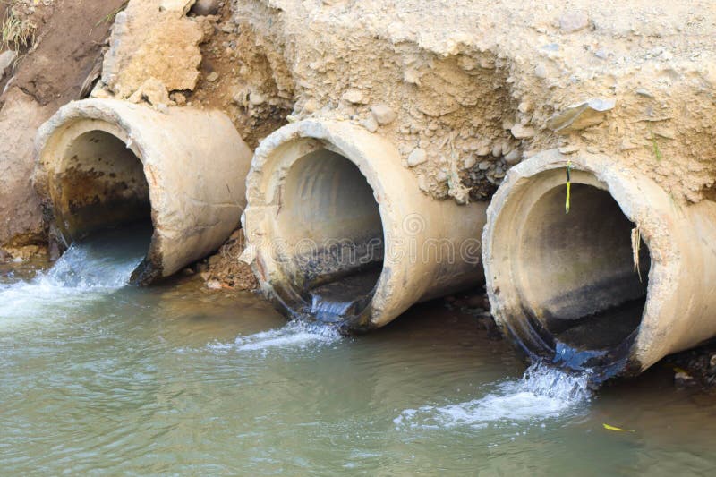 Drainage Pipe. Close Up Water Flows through a Drainage Pipe To the Next ...