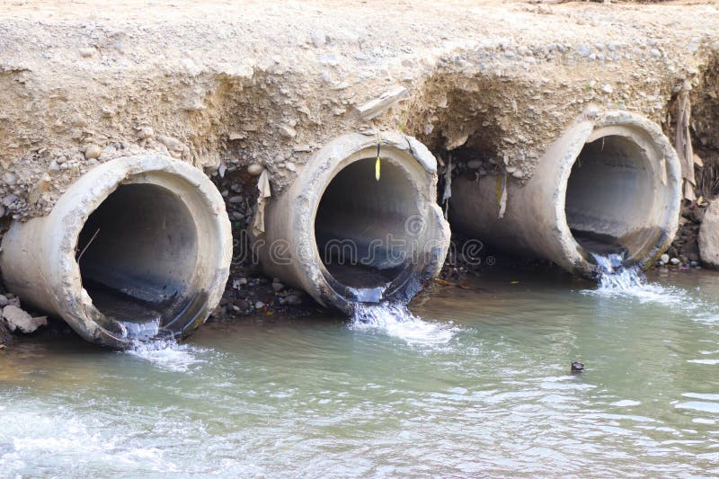 Drainage Pipe. Close Up Water Flows through a Drainage Pipe To the Next ...