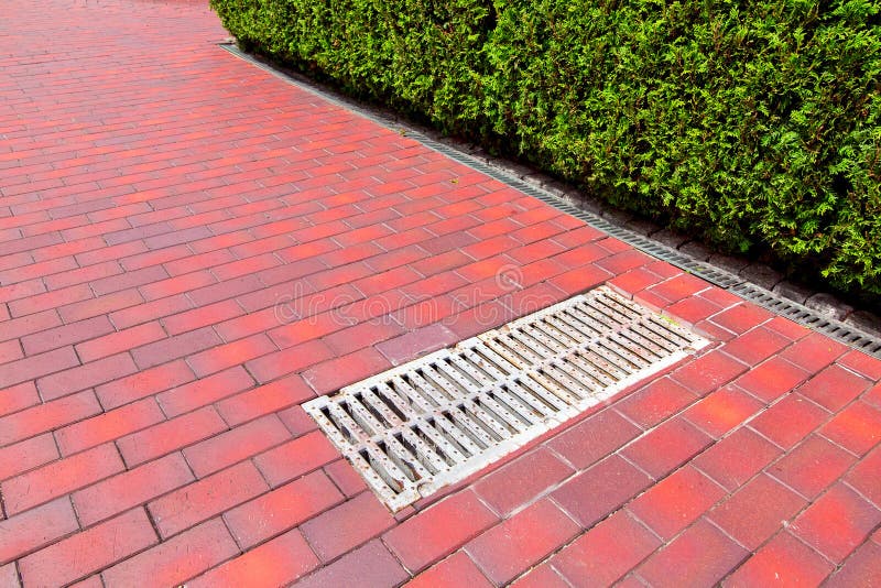Street Drainage Sewer System With Metal Grid Cover . Stock Image ...