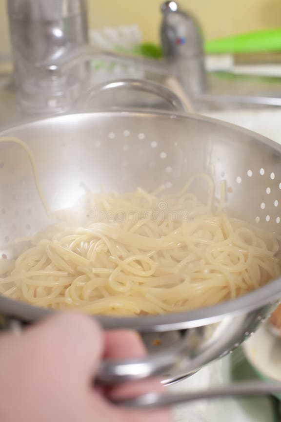 Draining Cooked Spaghetti stock image. Image of health - 151242171