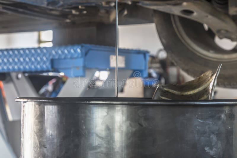 Draining Of Used Engine Oil. Stock Image - Image of maintenance ...