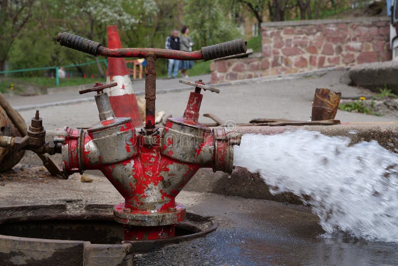Draining Water from Building Plumbing System. Water Flows from Faucet ...