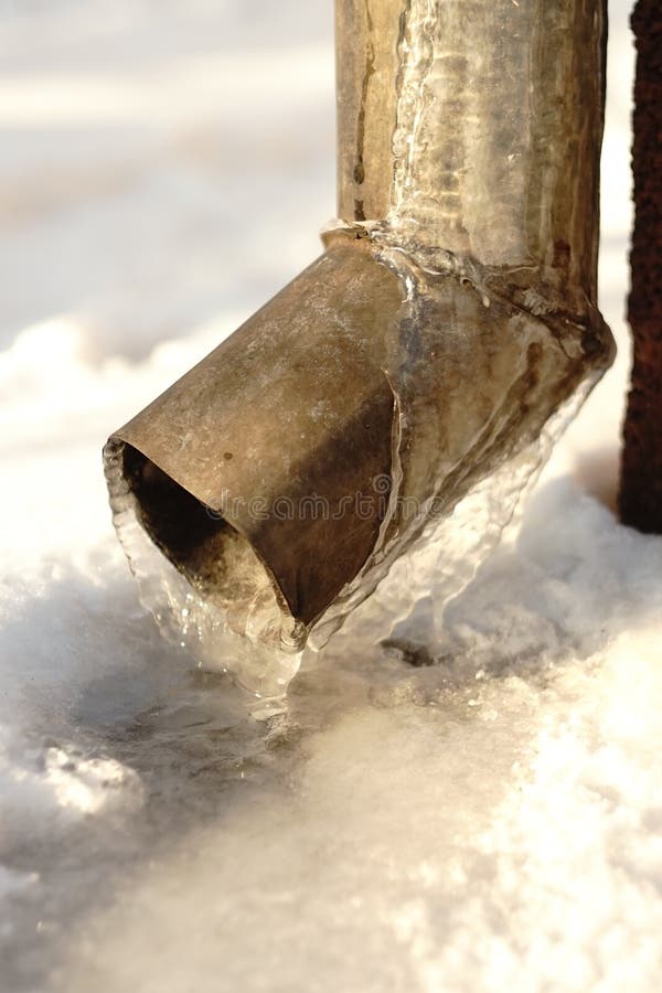 Drainpipe on the Corner of the House Covered with Ice Stock Image ...