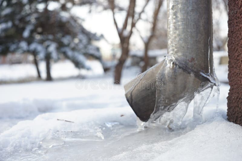 Drainpipe Covered with Ice on the Corner of the House Stock Image ...
