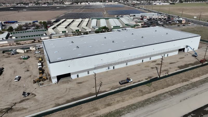 Flyover of Commercial Office or Warehouse Building Construction Site ...