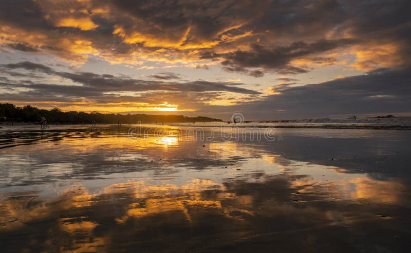 Dramatic Beach Sunset with Sky Reflection Stock Image - Image of ...