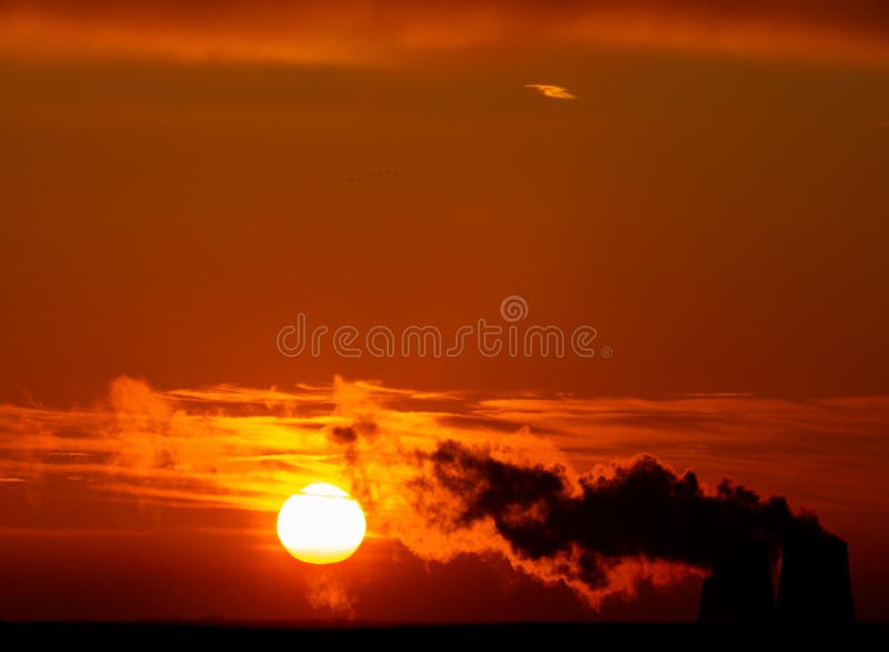 Dramatic Black Smoke with Orange Dawn Sky with the Rising Sun. Stock ...