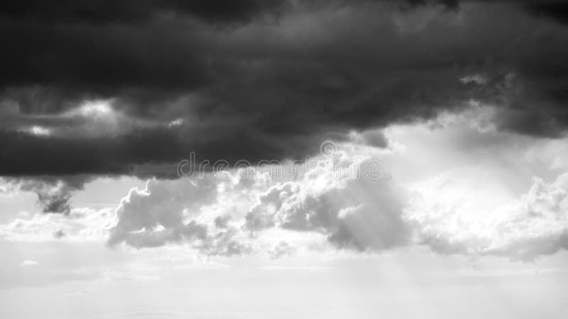 Dramatic Black and White Cloudscape with Light Rays, Ideal for Text ...
