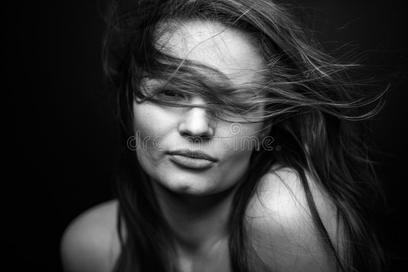 Dramatic Black And White Portrait Of A Beautiful Girl On A Dark