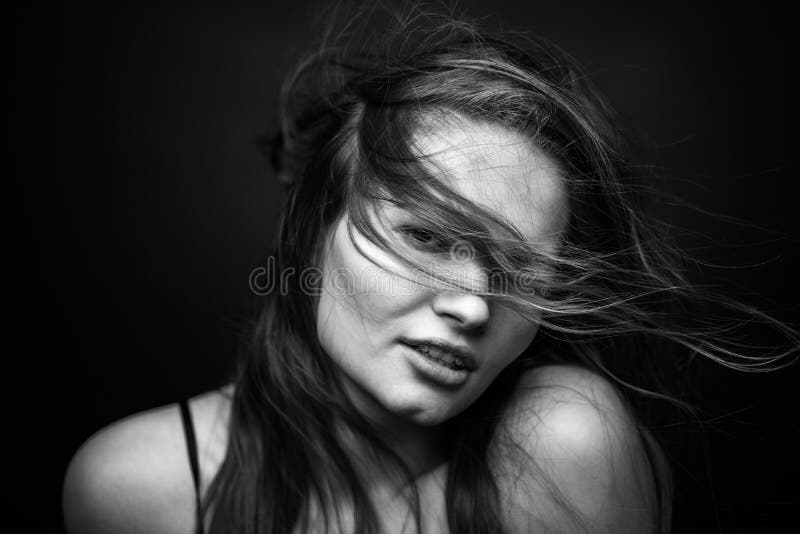 Dramatic Black And White Portrait Of A Beautiful Girl On A Dark