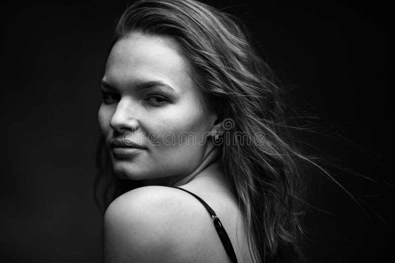 Dramatic Black And White Portrait Of A Beautiful Girl On A Dark