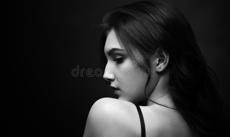 Dramatic Black And White Portrait Of A Beautiful Girl On A Dark