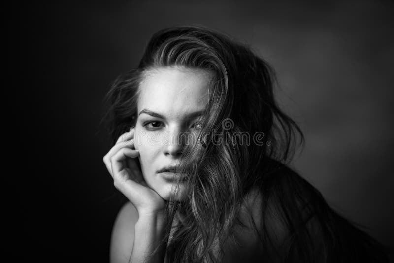 Dramatic Black And White Portrait Of A Beautiful Girl On A Dark