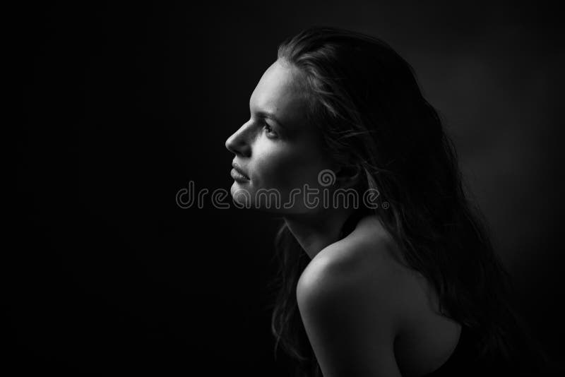 Dramatic Black And White Portrait Of A Beautiful Girl On A Dark