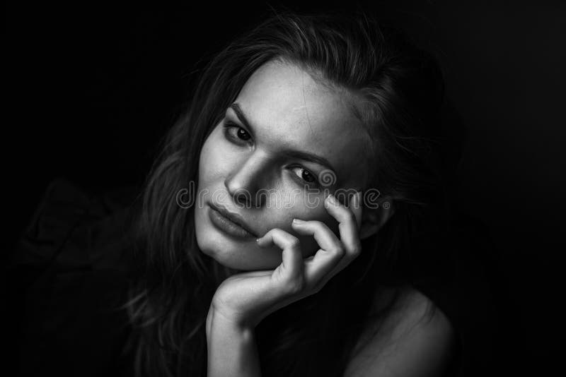 Dramatic Black And White Portrait Of A Beautiful Girl On A Dark