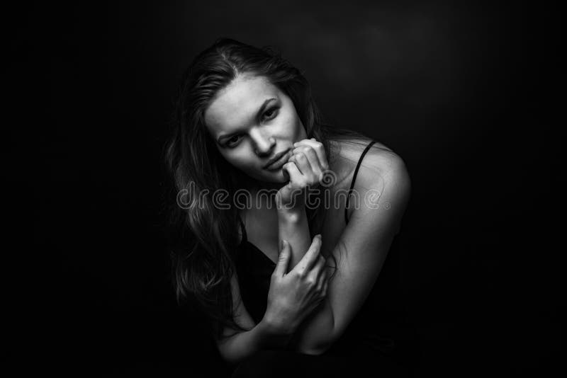 Dramatic Black And White Portrait Of A Beautiful Girl On A Dark