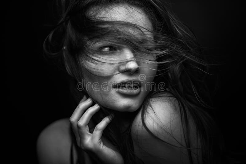 Dramatic Black And White Portrait Of A Beautiful Girl On A Dark