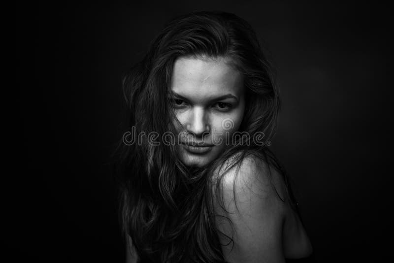 Dramatic Black And White Portrait Of A Beautiful Girl On A Dark