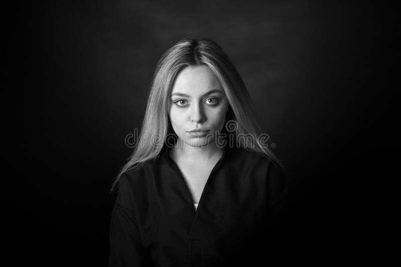 Dramatic Black And White Portrait Of A Beautiful Woman On A Dark