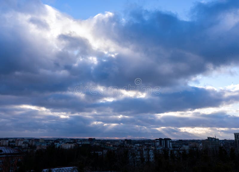 Dramatic Blue-grey Sky and Rays of Sun Breaking through the Clouds ...