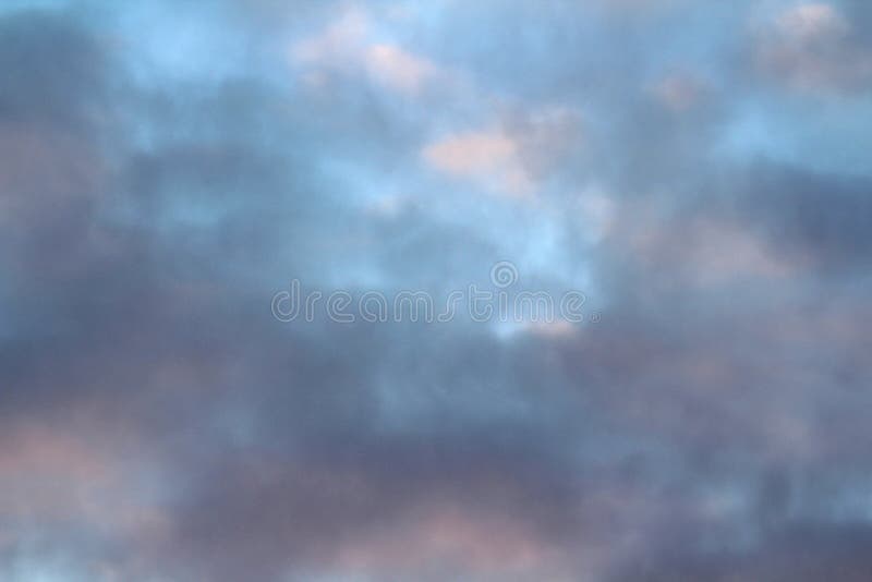 Dramatic Blue Sky with Clouds Backlit by the Sun at Dusk Stock Image ...