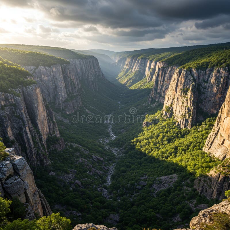 A Dramatic Canyon Landscape Under a Cloudy Sky Features Steep, Rugged ...