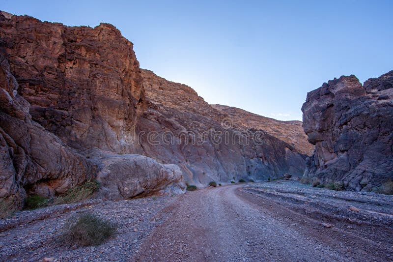 A Dramatic Canyon Road Winding through Rocky Cliffs in a Remote Desert ...