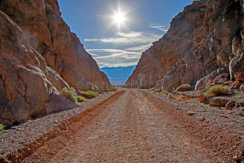 A Dramatic Canyon Road Winding through Rocky Cliffs in a Remote Desert ...