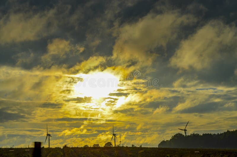 Dramatic Cloud Formations Over Wind Turbines at Dusk Stock Image ...