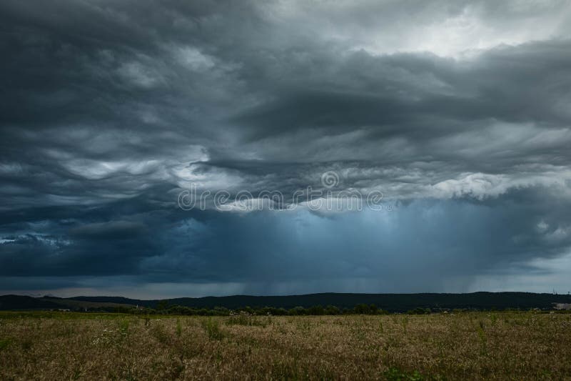 Heavy Rain and Hail Falls from a Thunderstorm Over the Plains Stock ...