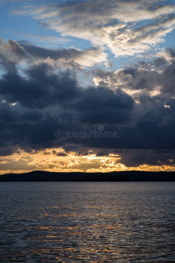 Dramatic Clouds Above a Lake at Sunset Stock Photo - Image of dark ...