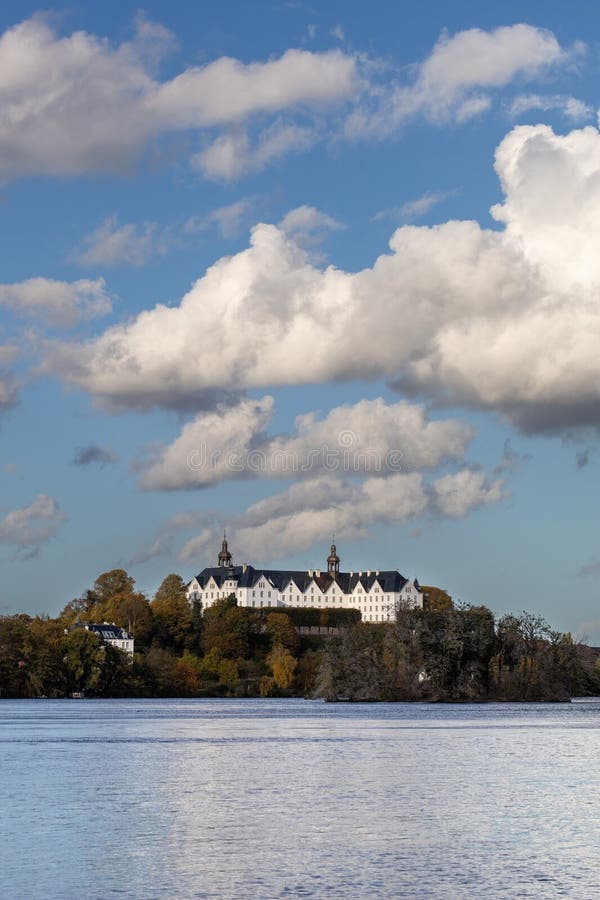 Dramatic Clouds Fly Over the Lake in the Background Ploen Castle, in ...