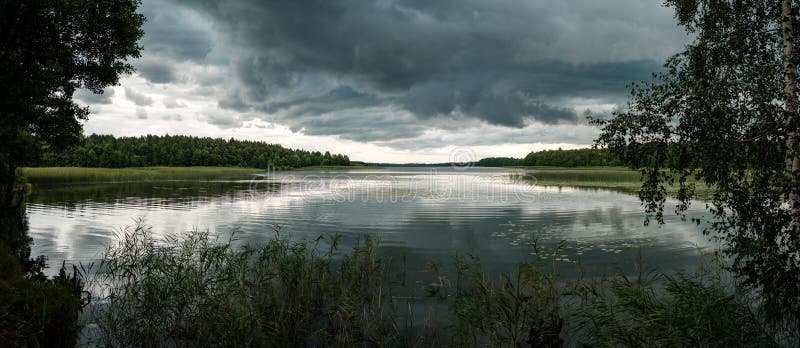 Dramatic Clouds Over Blue Lake Stock Image - Image of dusk, natural ...