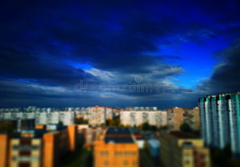 Dramatic Clouds Over Blurred Abstract City Background Stock Image ...