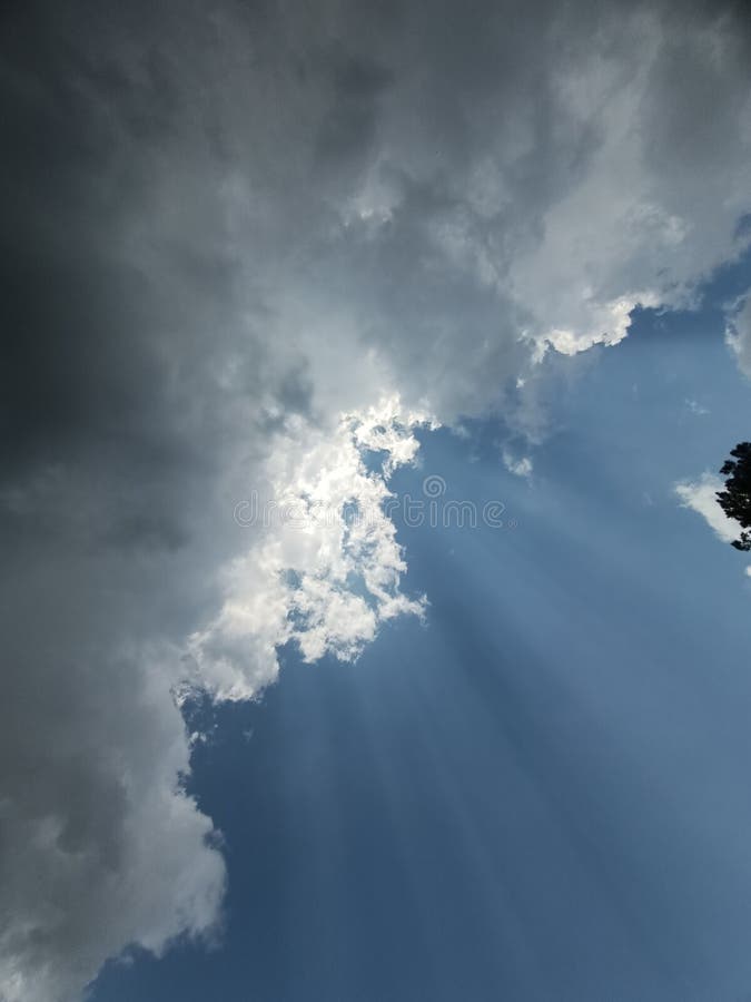 Dramatic Clouds with Sun Rays Breaking through the Sky Stock Image ...