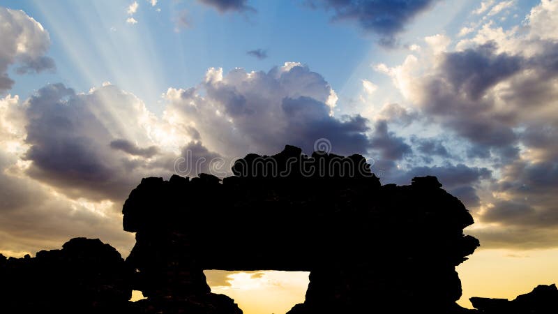Dramatic Cloudscape with Sun Rays Rock Gate Silhouette Stock Photo ...