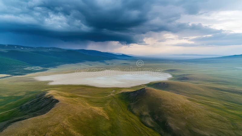 Dramatic Cloudy Sky Over Vast Mountainous Landscape and Open Grassland ...