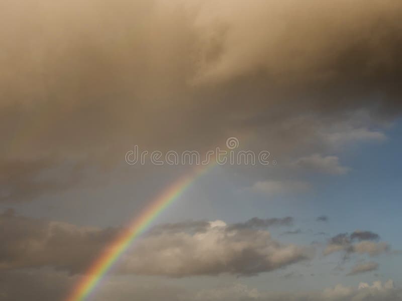 Dramatic Cloudy Sky with Rainbow Symbol of Luck. Nature Phenomenon ...