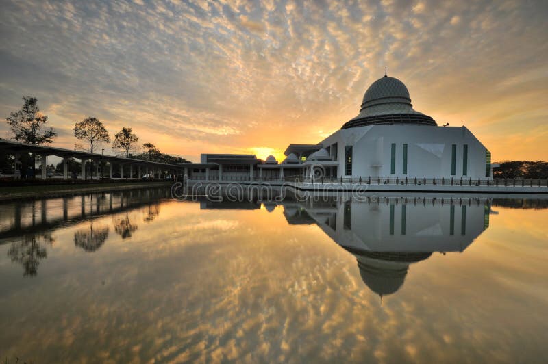 Dramatic Cloudy Sunrise Over White Floating Mosque. Stock Photo - Image ...