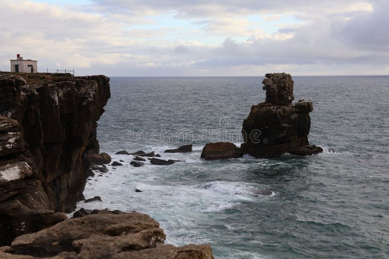 Dramatic Coastal Cliff and Sea Stack Stock Photo - Image of rising ...