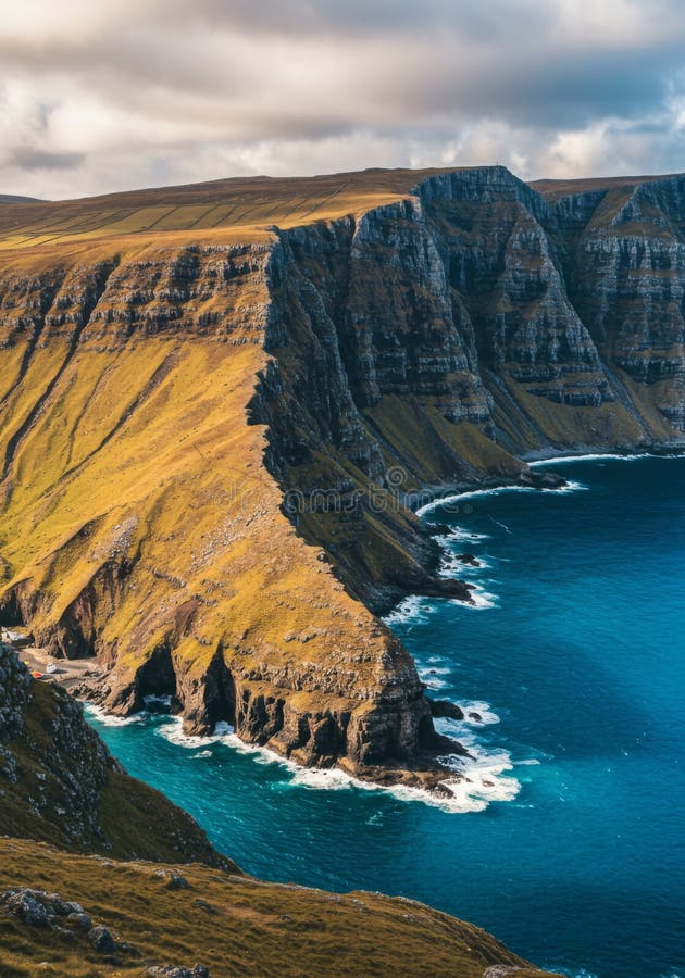 Dramatic Coastal Cliffs with Golden Hills and Deep Blue Ocean Stock ...